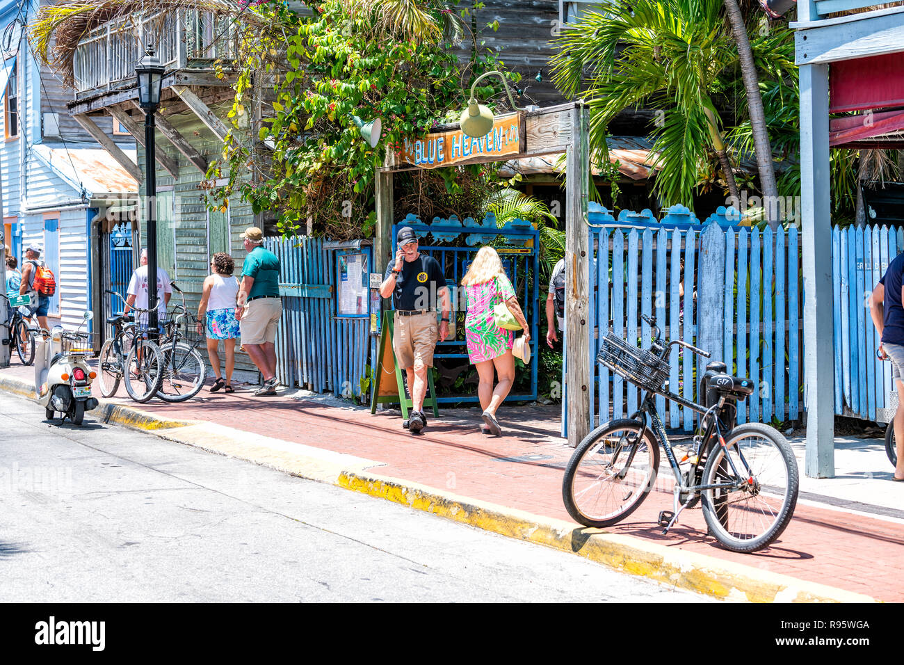 Key West, USA - May 1, 2018: People walking by Blue heaven restaurant ...