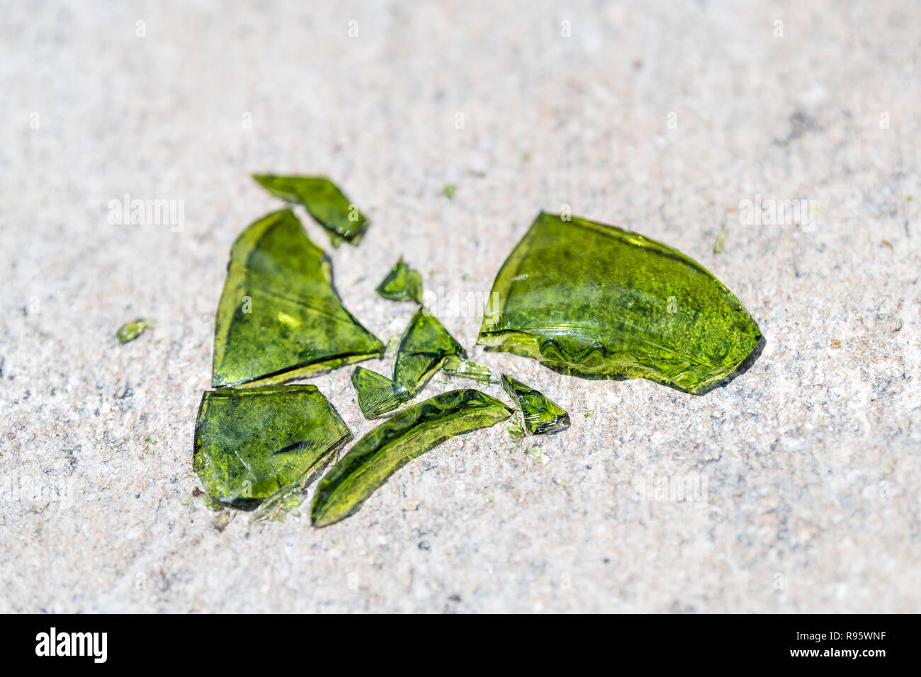 Closeup of many shattered, broken pieces, fragments, parts of green ...