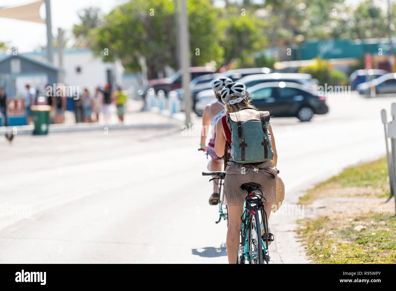 Back view girl riding bicycle hi-res stock photography and images - Alamy