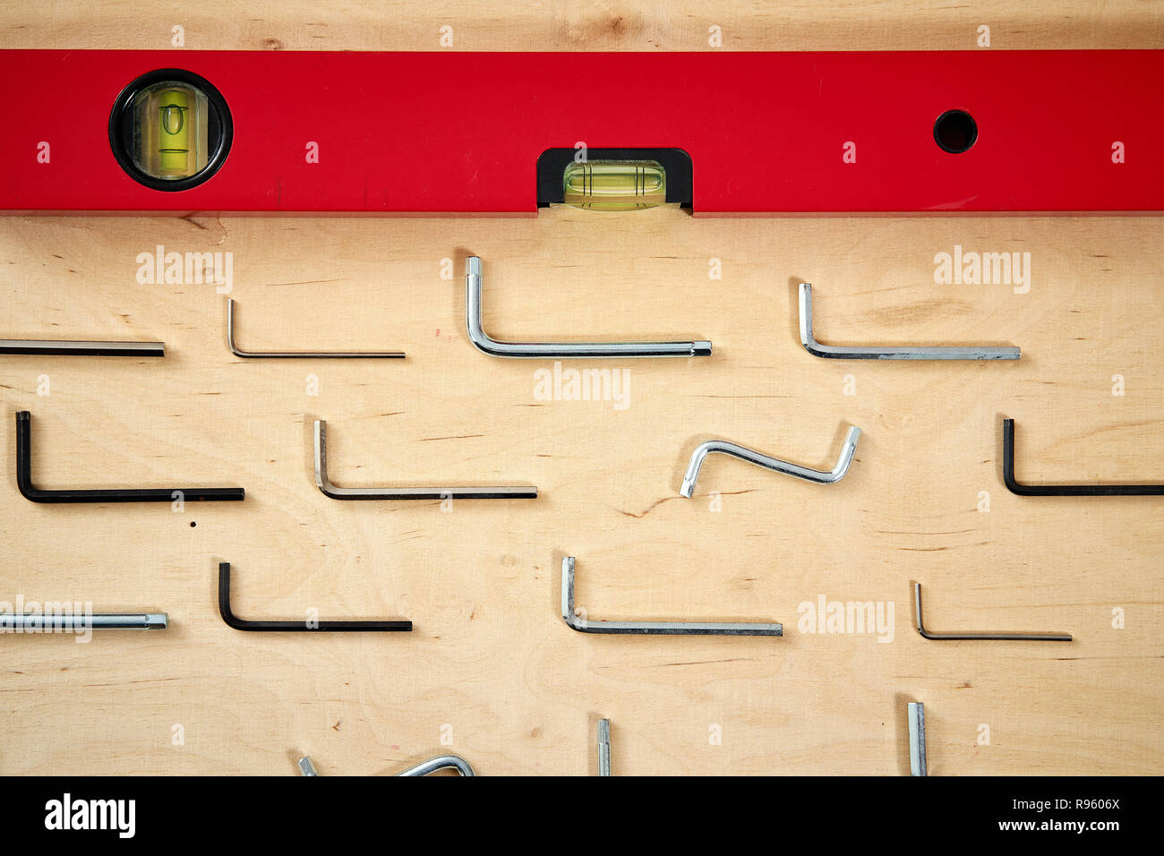 pattern background of various allen keys with level spirit on wooden ...