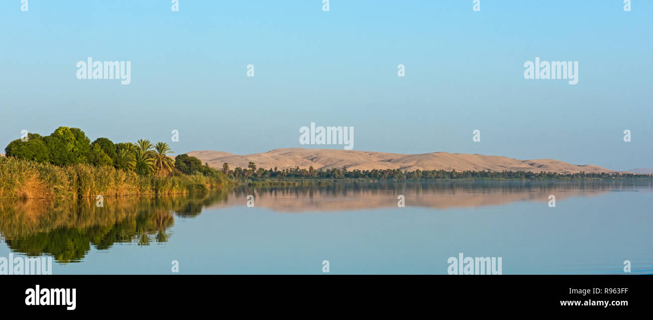View across large wide river Nile in Egypt through rural countryside ...