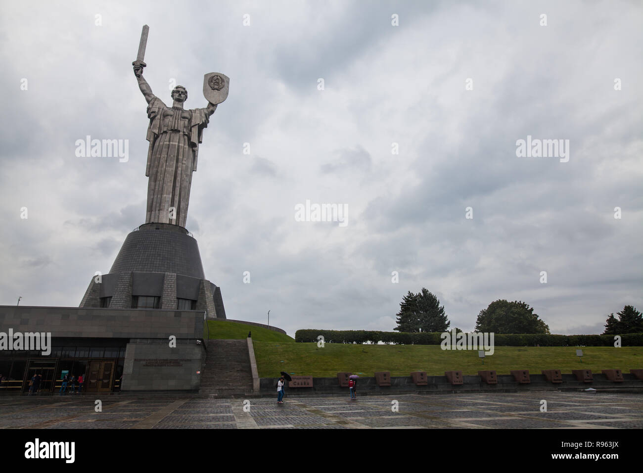 Soviet Motherhood statue with shield and sword, against a cloudy sky ...