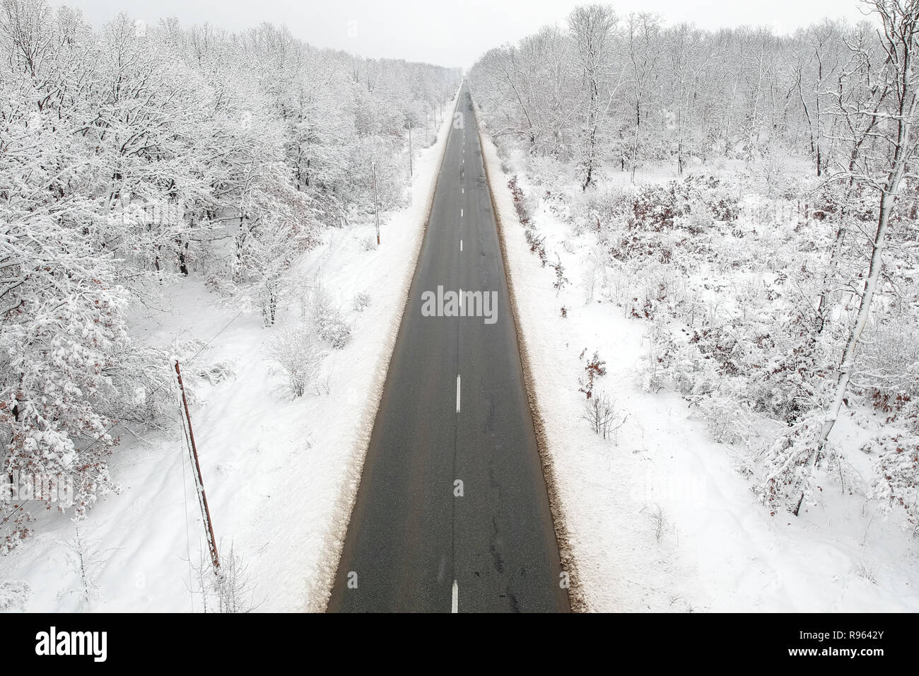 Aerial view car driving snow covered field hi-res stock photography and ...