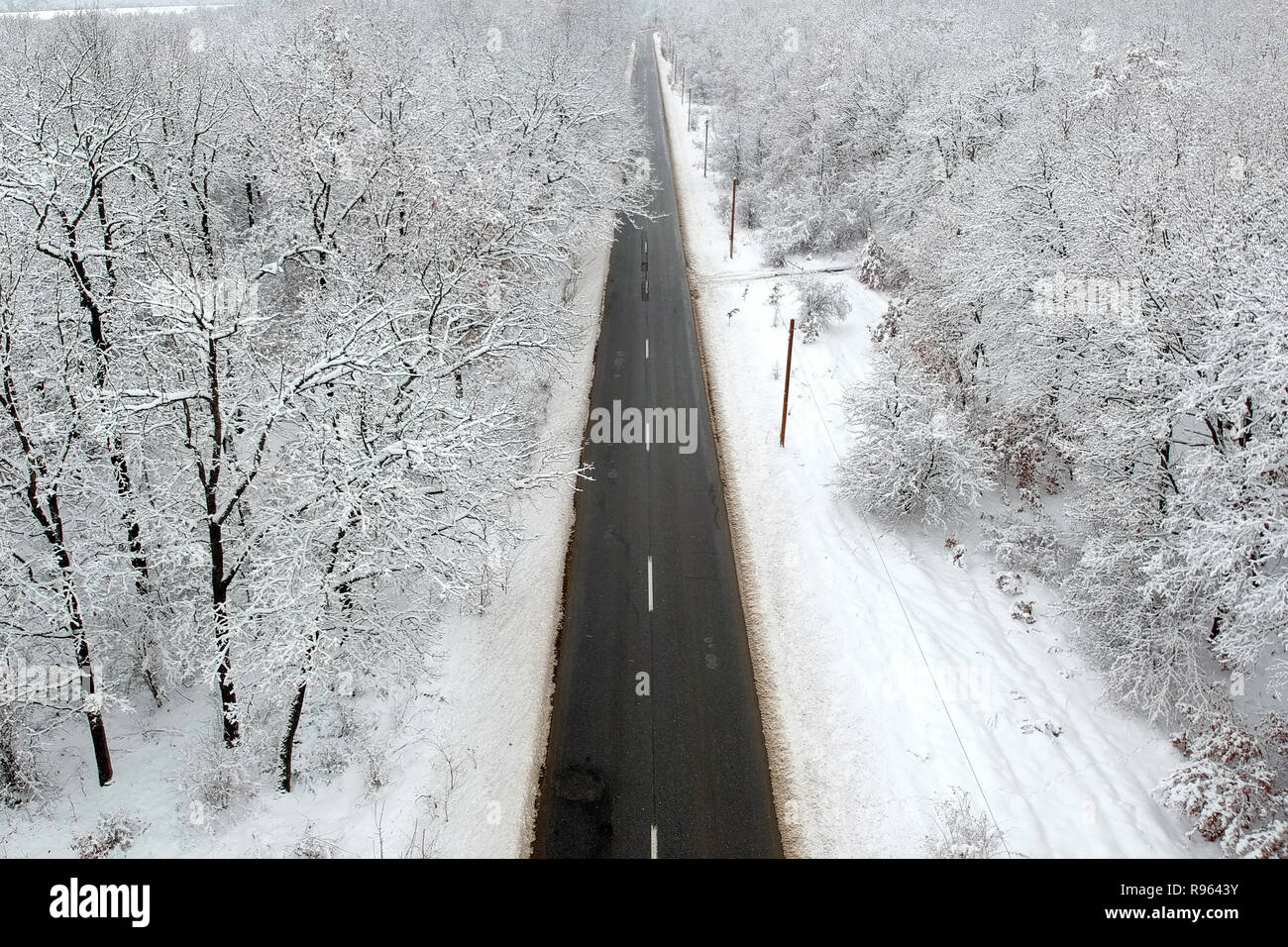 Aerial view car driving snow covered field hi-res stock photography and ...