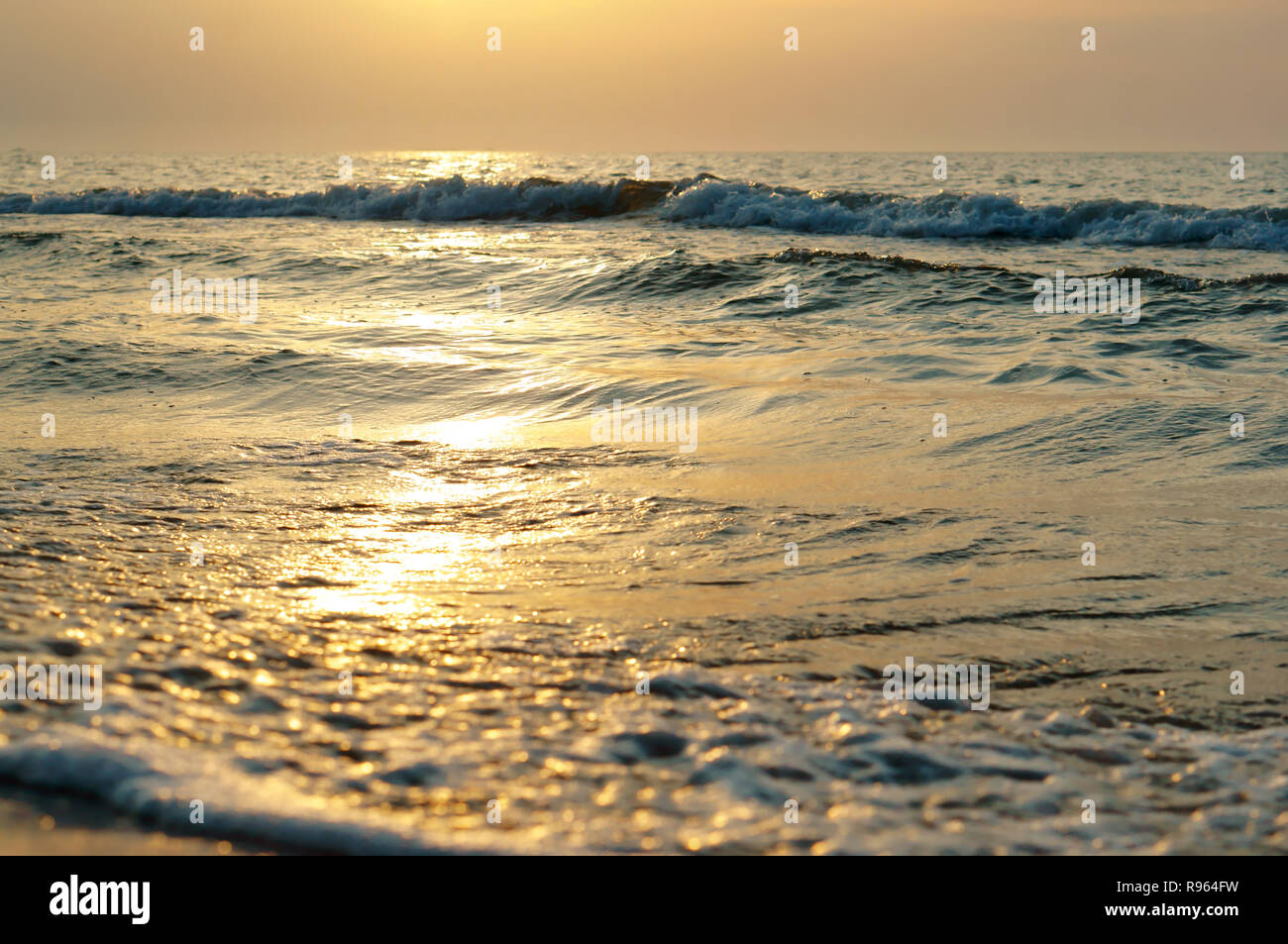 Sunset over the sea. Reflection of sunlight in the sea waves. Red sky ...