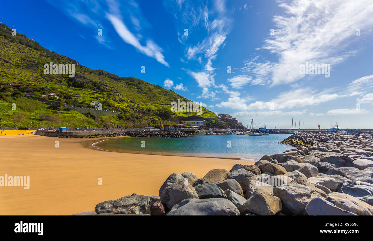 Tropical Machico bay beach on the coast of Madeira island. Tourist ...