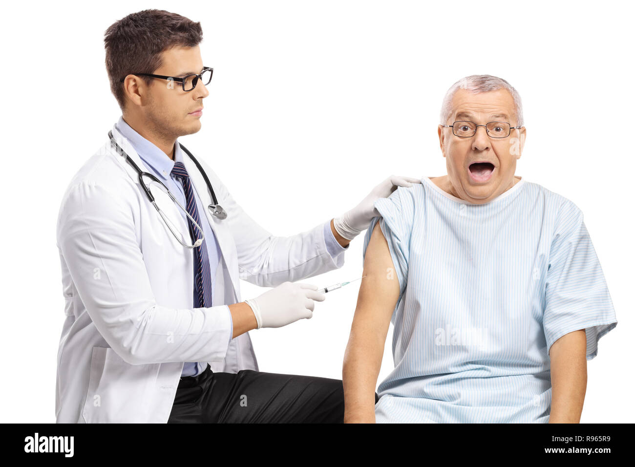 Young male doctor giving an injection shot to a scared mature patient ...