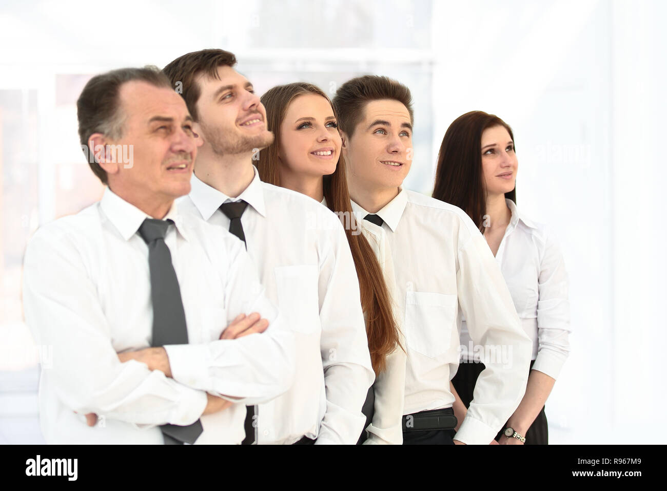 successful business team looking at copy space Stock Photo - Alamy