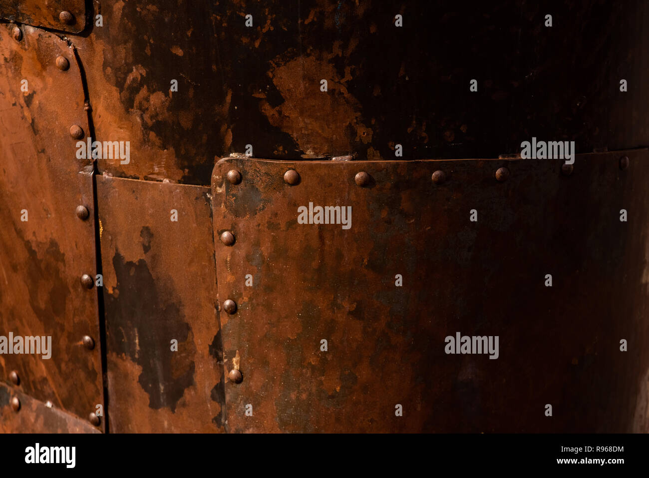 Rusted steel plates joined with rivets Stock Photo - Alamy