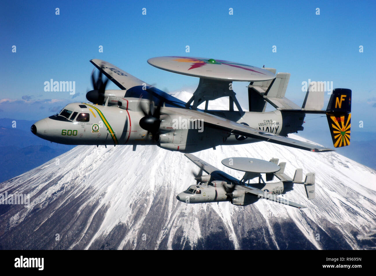 Two U.S. Navy E-2C Hawkeye aircraft conduct a flyby of Mount Fuji in ...