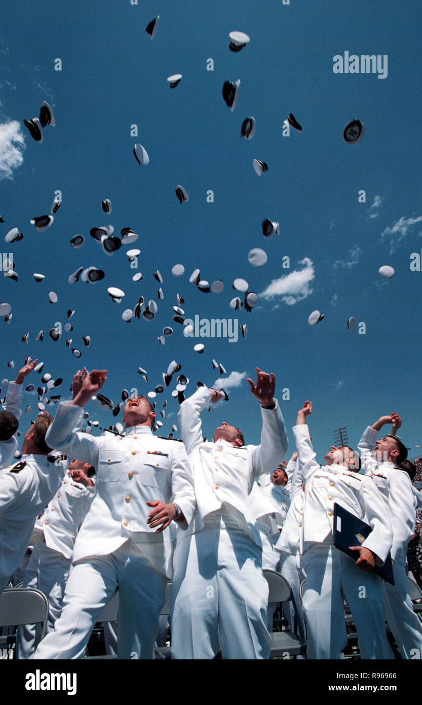 Graduates of the United States Naval Academy keep the "hat toss ...