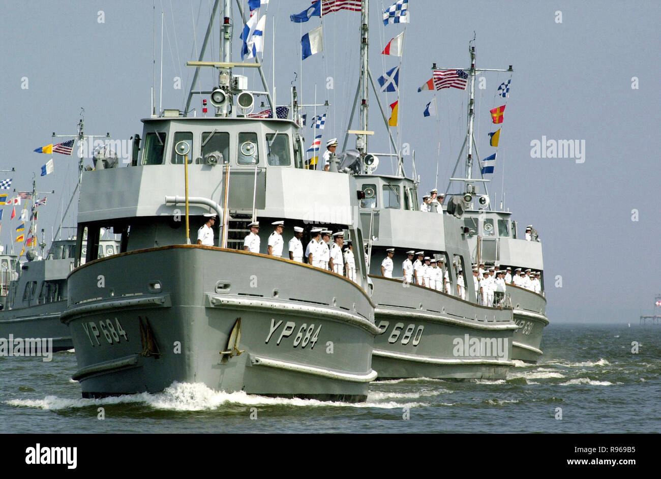 U.S. Naval Academy craft line up and the crews man the rail for a pass ...