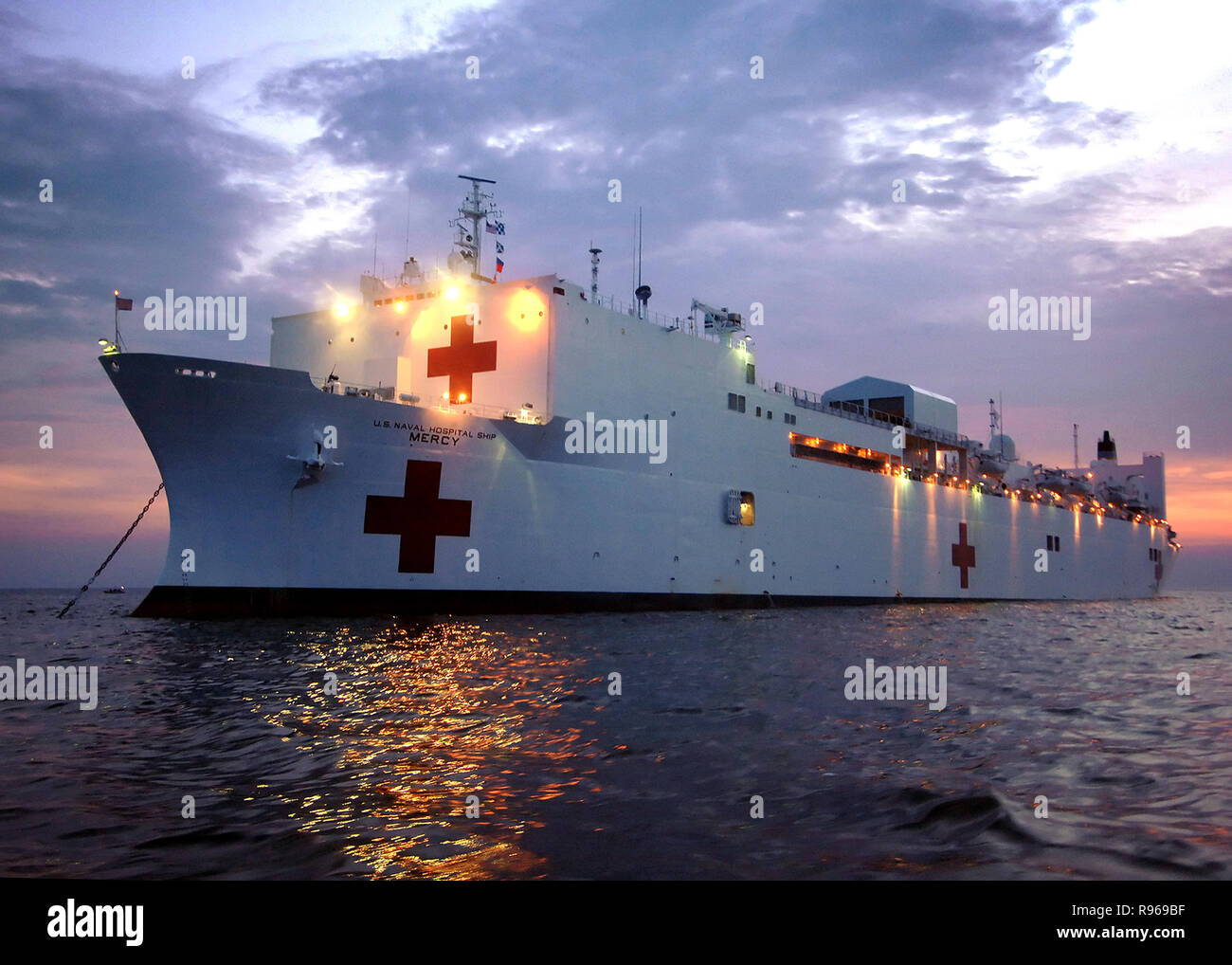 The U.S. Navy hospital ship USNS Mercy is anchored off the coast of ...