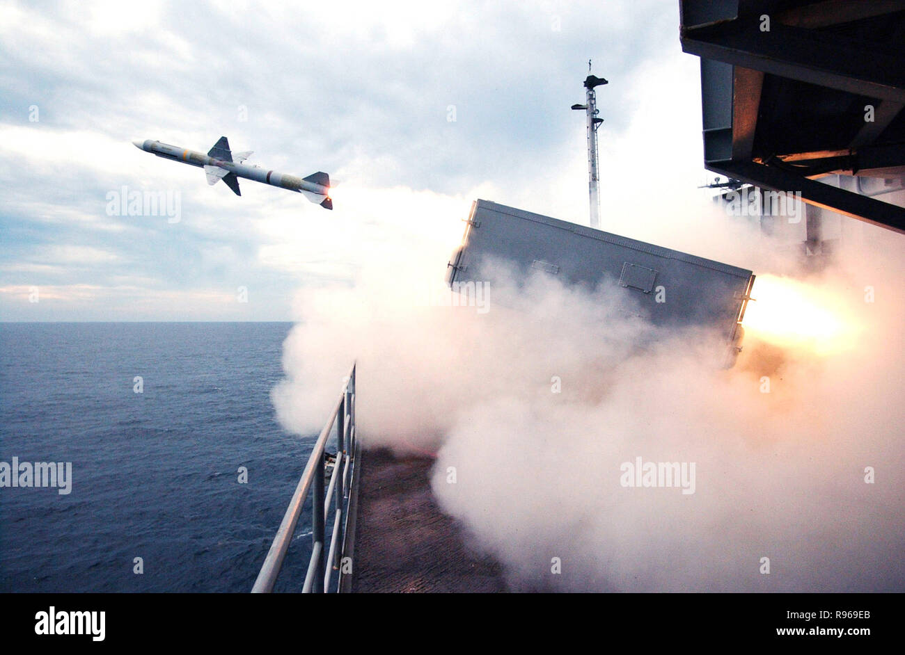 A NATO Sea Sparrow missile is launched from the aircraft carrier USS ...