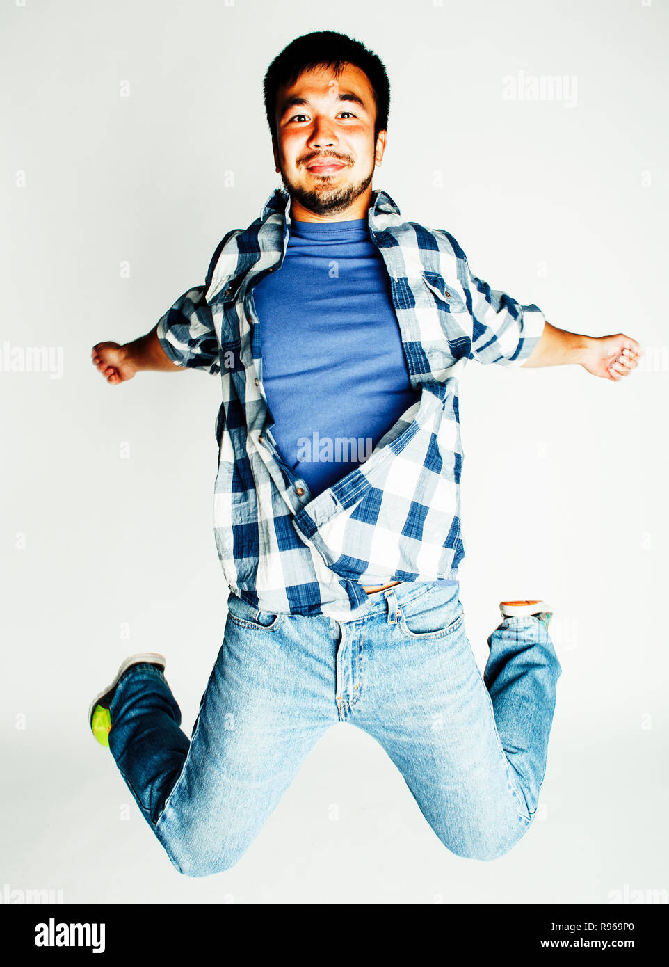 young pretty asian man jumping cheerful against white background Stock ...