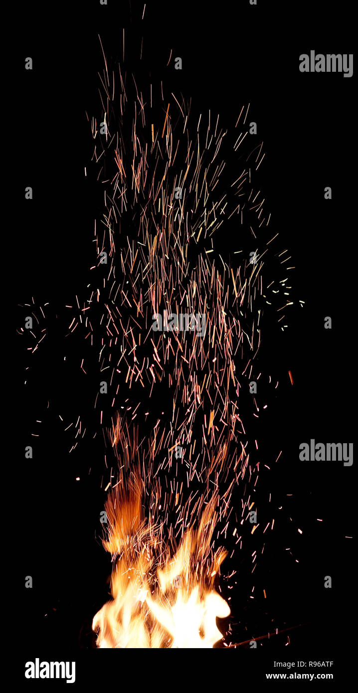 Fire flames with sparks on a black background Stock Photo - Alamy
