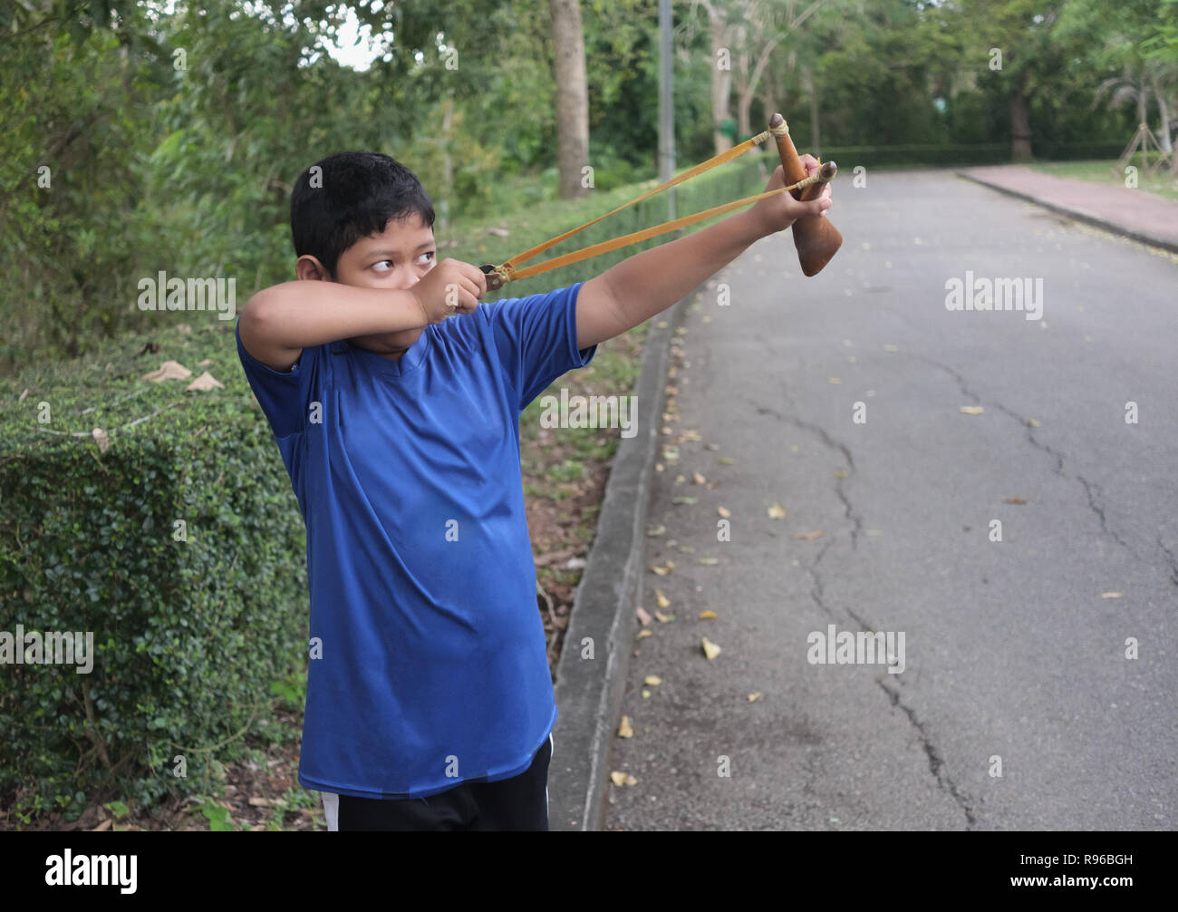 Bully boy aiming the target Stock Photo - Alamy