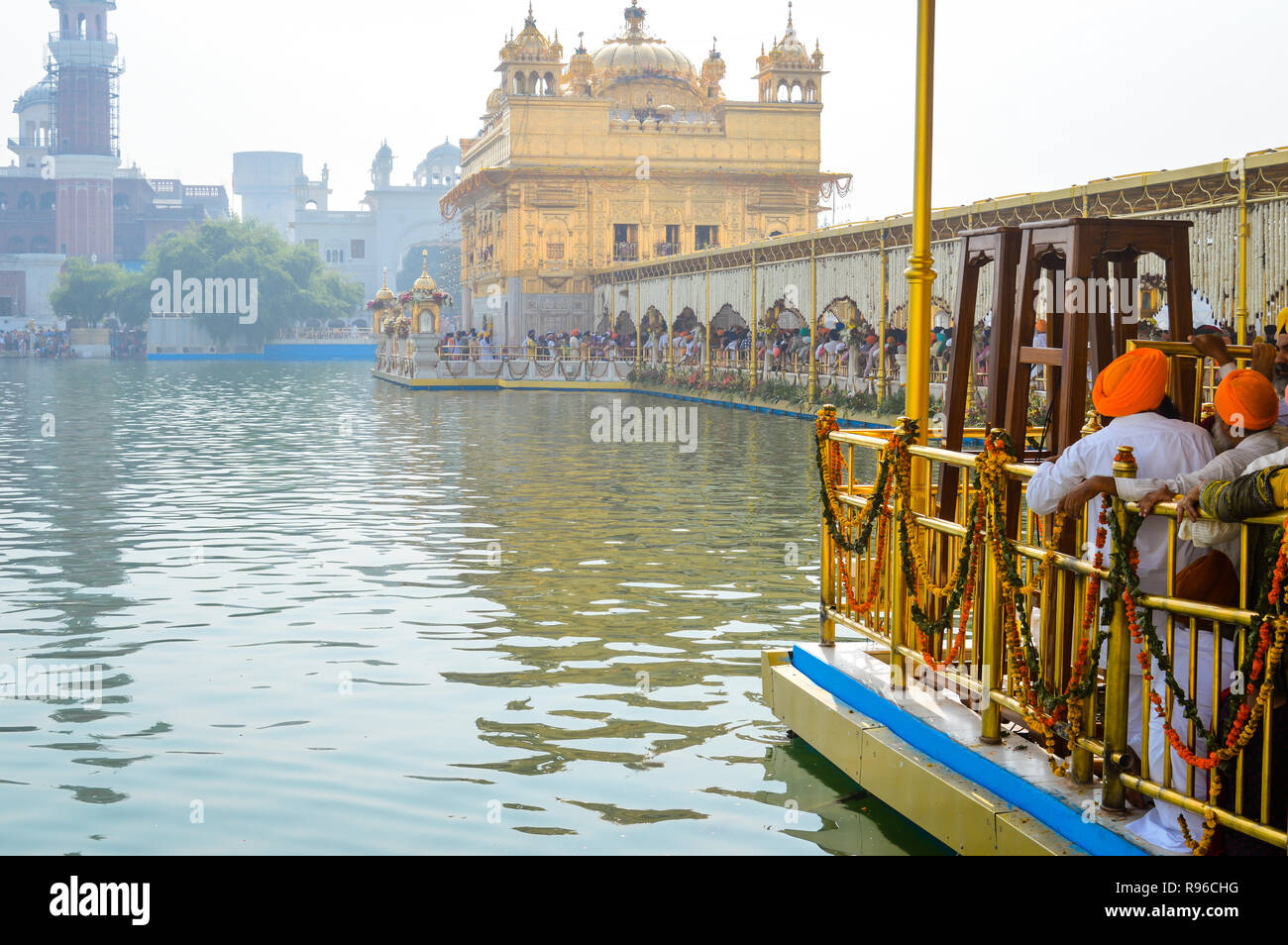 Amritsar, India - MAY 16 2016: People standing in a row at entrance ...