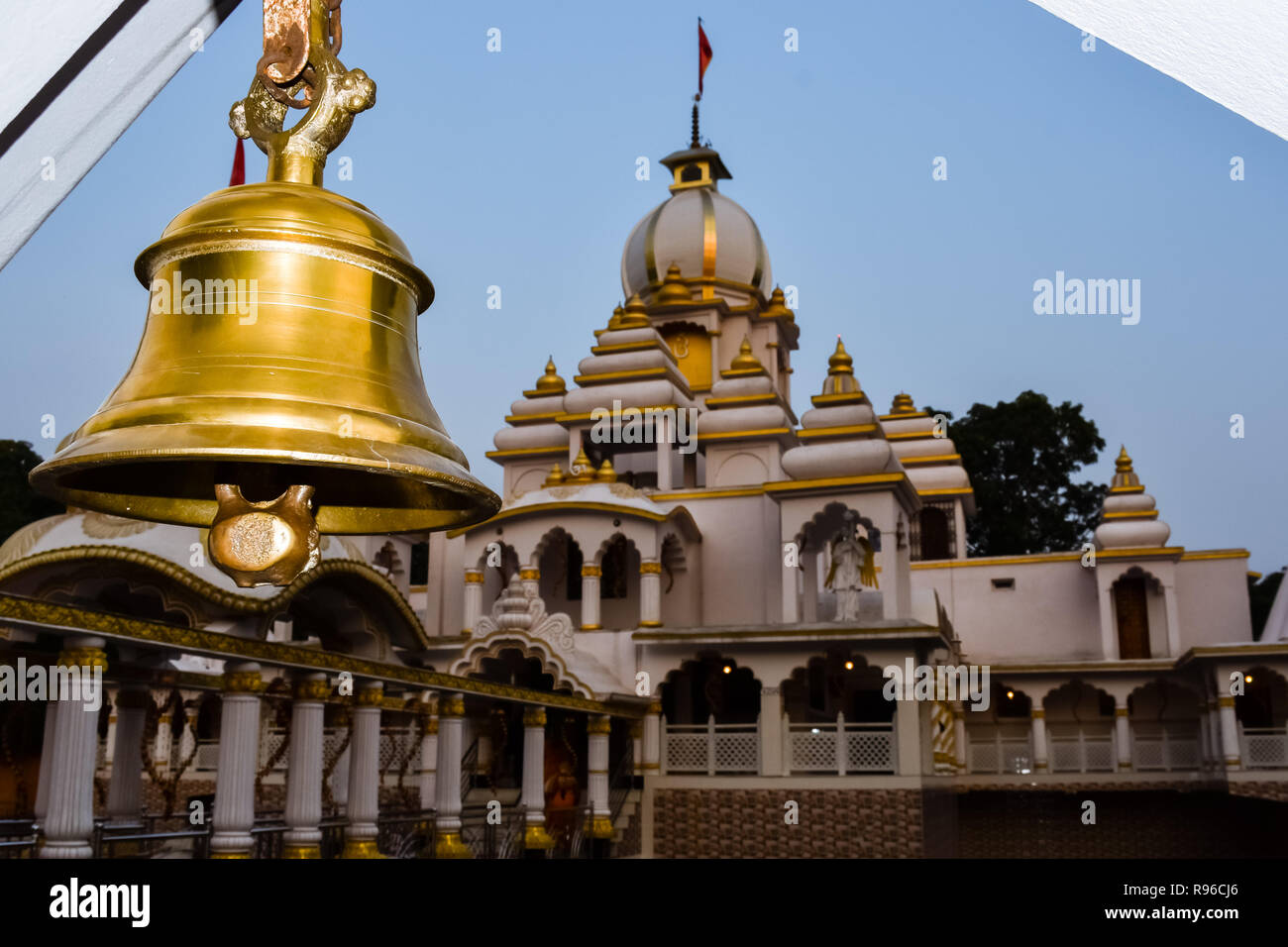 Ring bells in temple. Golden metal bell isolated. Big brass Buddhist ...