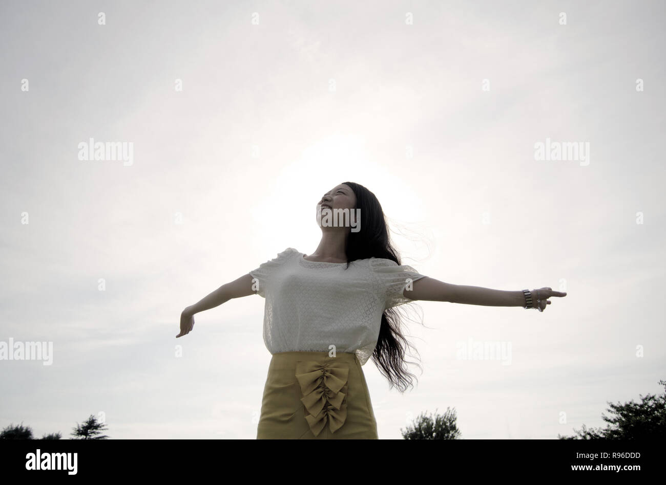 Asian female model poses for pictures in the nature Stock Photo - Alamy