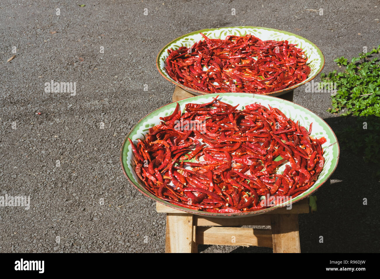 sun drying red chili on tray. dried hot chilli pepper Stock Photo - Alamy