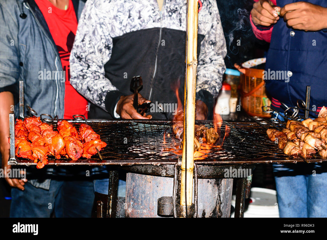 Shish kebab preparation on barbecue grill over charcoal. Roast Beef on ...