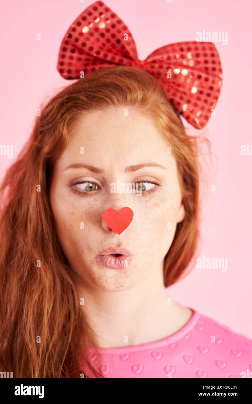 Playful woman making a face at studio shot Stock Photo - Alamy