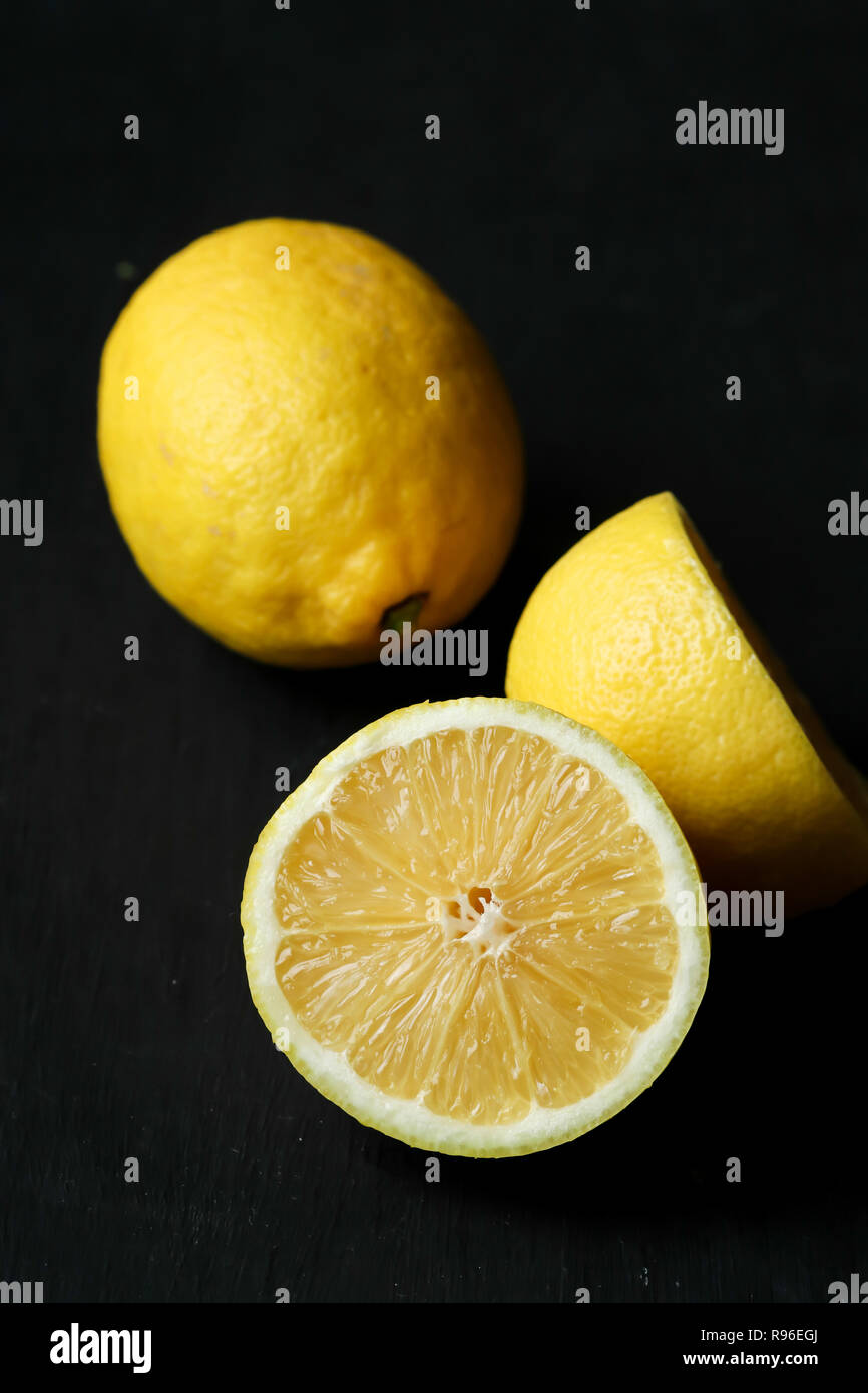 Lemon on a black background Stock Photo - Alamy