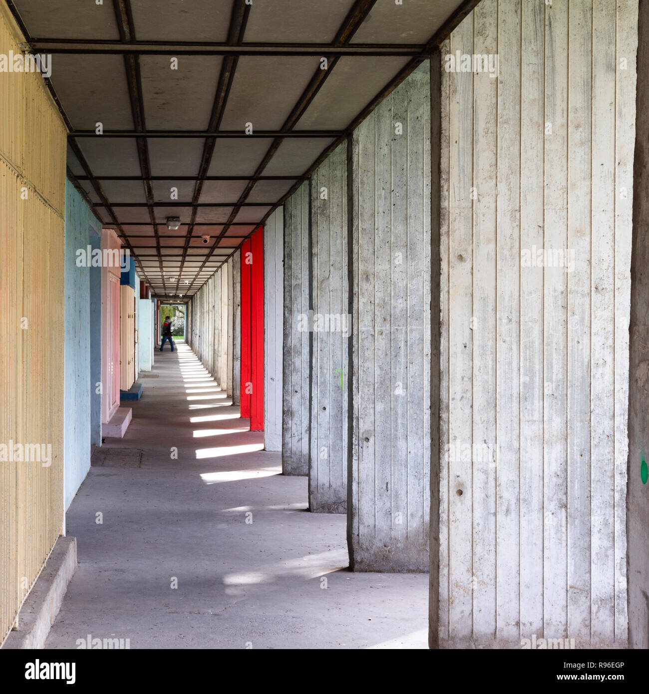 Modern concrete arcade corridor under a huge block of flats in Budapest ...
