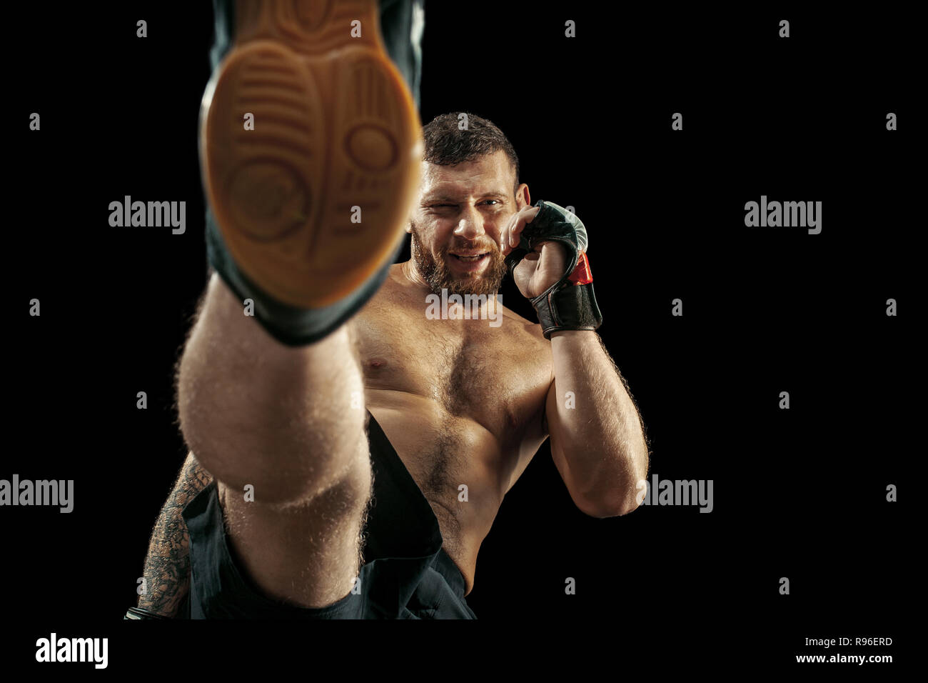 MMA. professional boxer boxing isolated on black studio background. fit ...