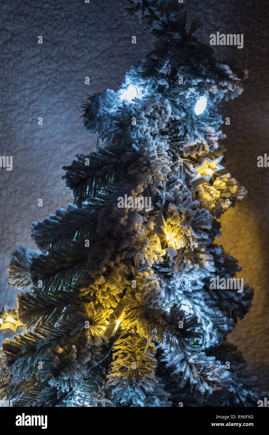 A photo of a lit Christmas tree with colorful background Stock Photo ...