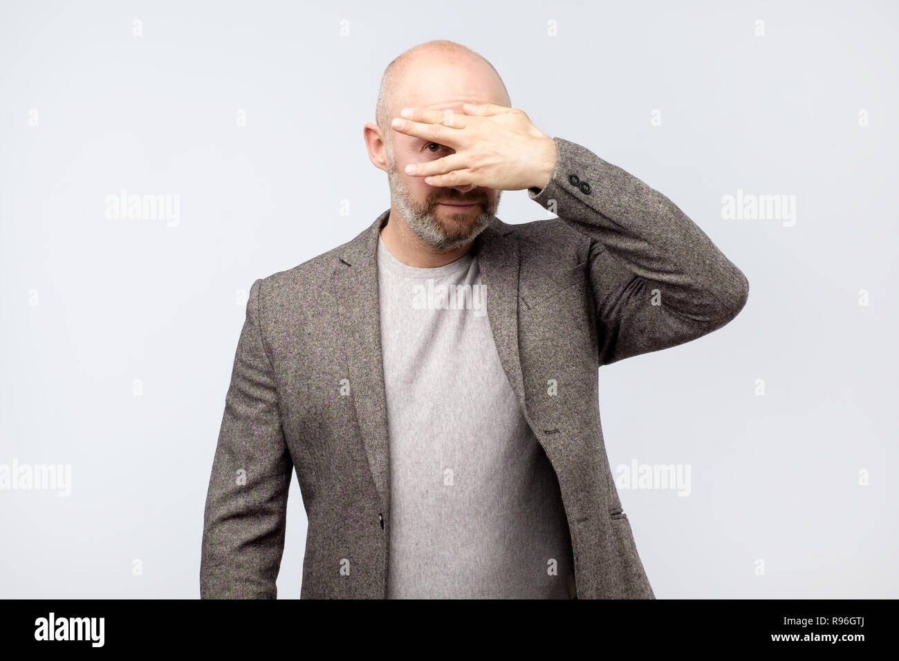 Man covering his face hi-res stock photography and images - Alamy