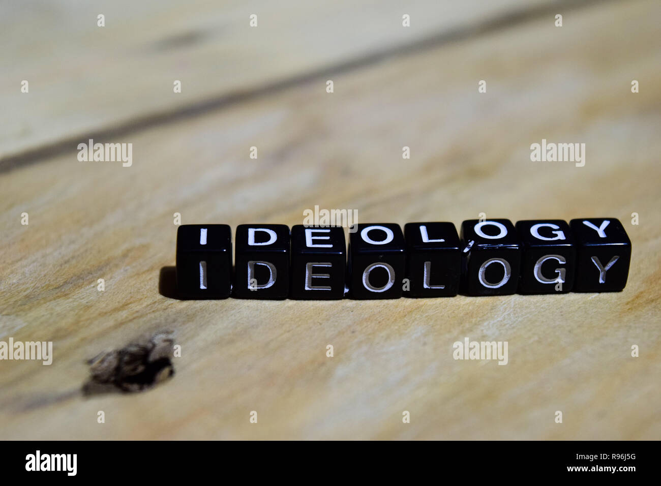Ideology written on wooden blocks. Inspiration and motivation concepts ...