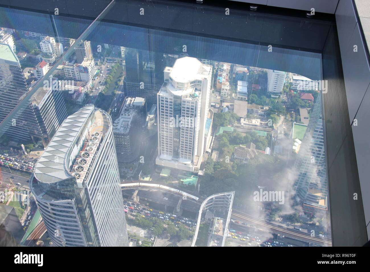 A detailed view of Mahanakhon skywalk with Bangkok streets at the ...
