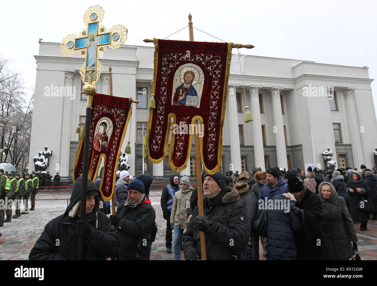 Ukrainian believers seen carrying holy crosses with images of saints ...