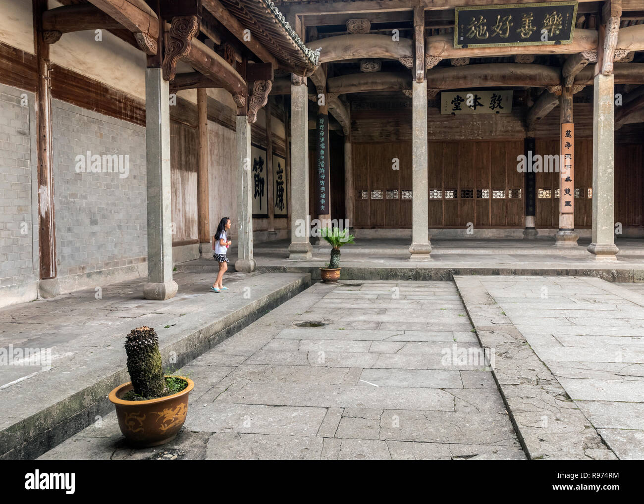 Young girl playing in Dun Ben Tang (Ancestral Hall for Men) Tangyue ...