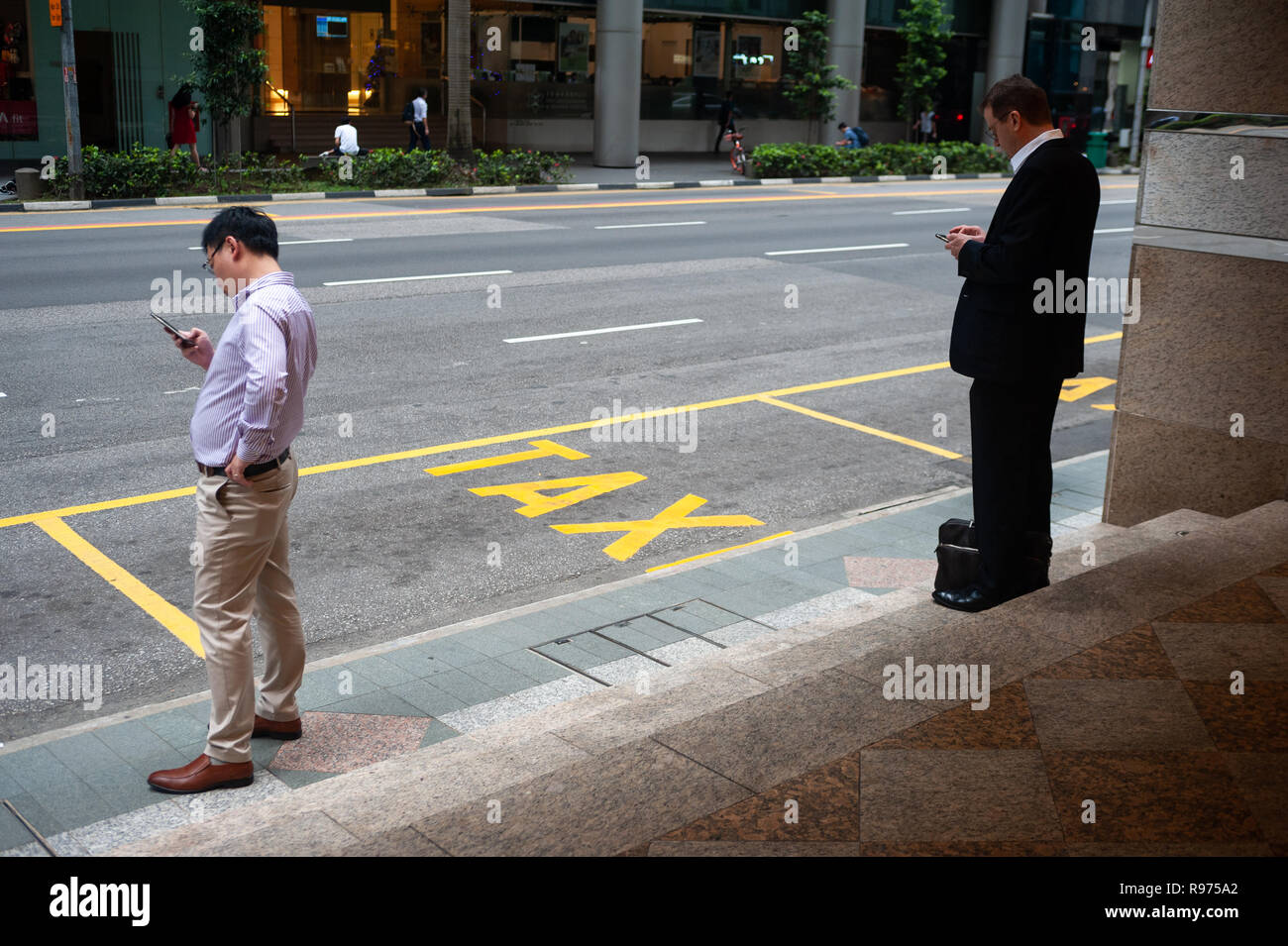 Businessman waiting for cab hi-res stock photography and images - Alamy