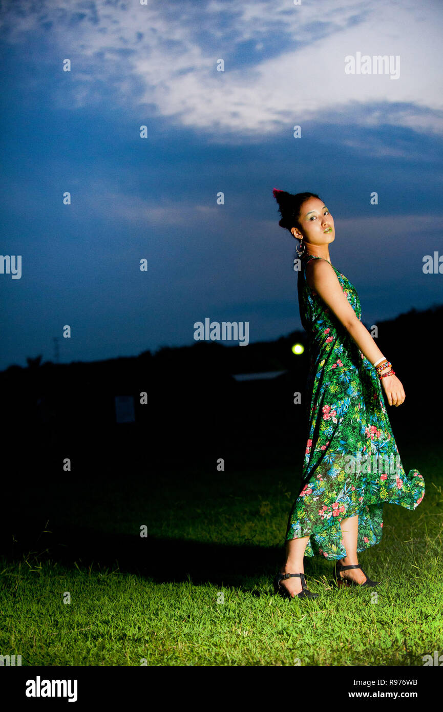 Asian female model poses for pictures in the nature Stock Photo - Alamy