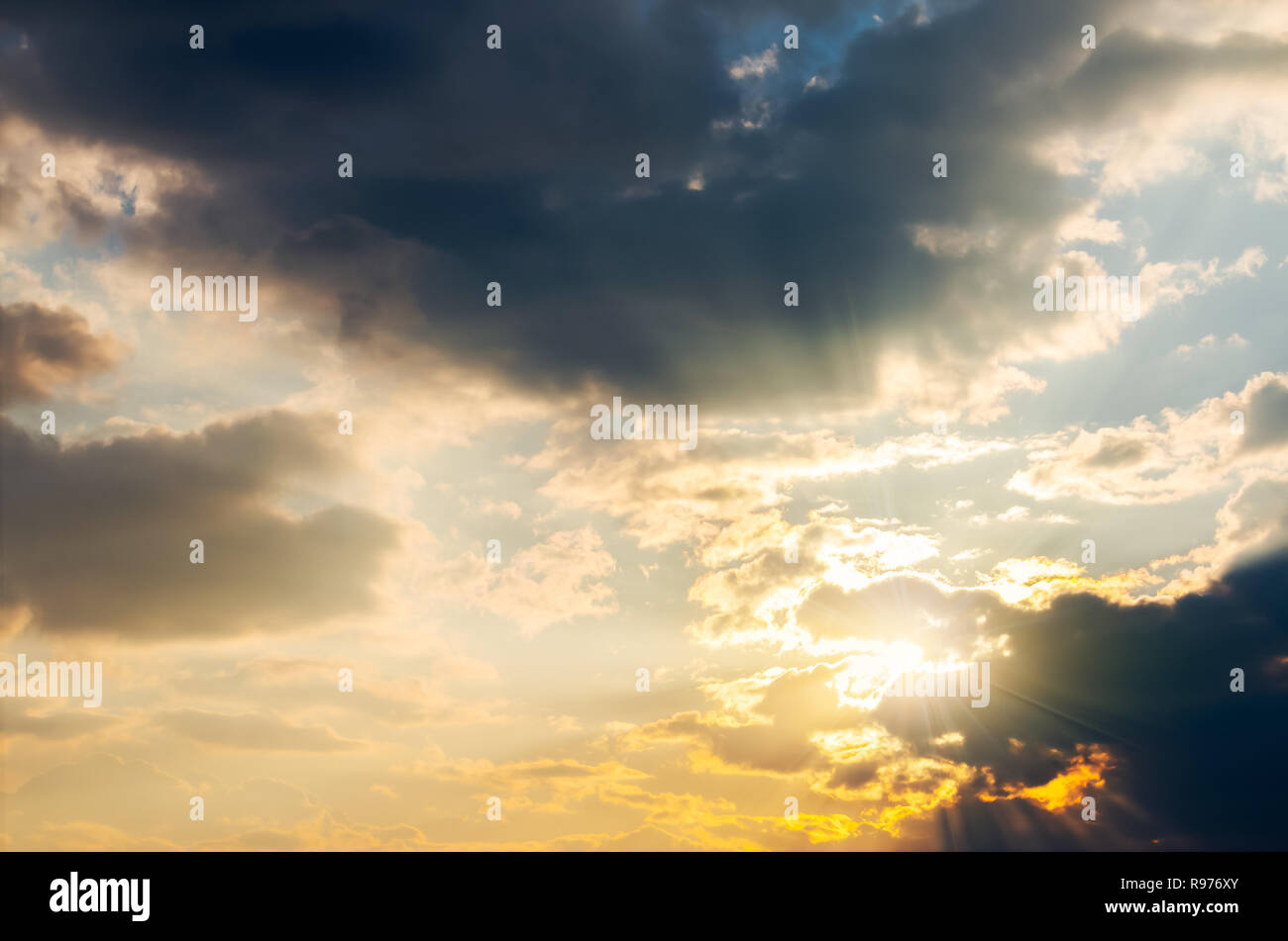 gorgeous sunlight through clouds. lovely nature background Stock Photo ...