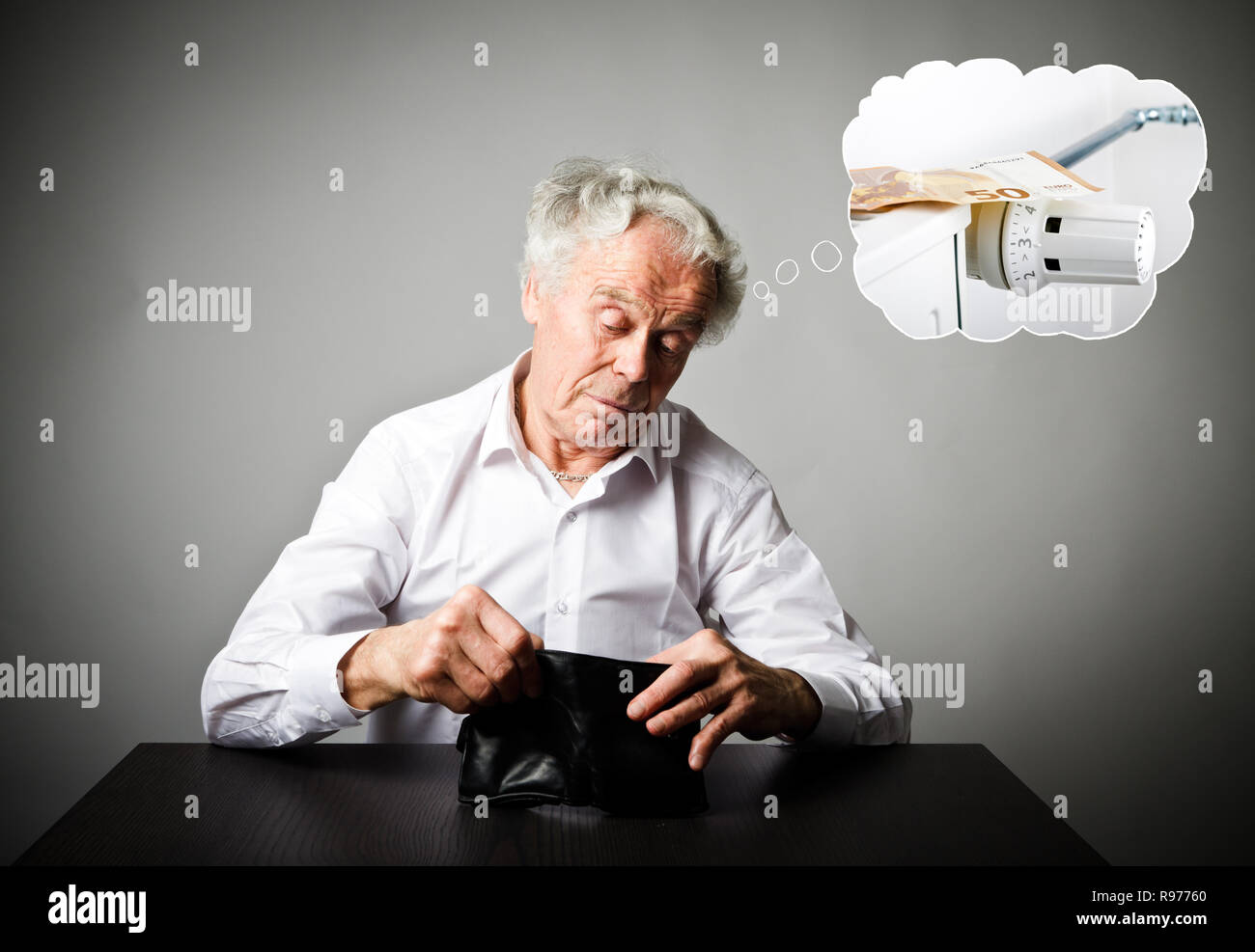 Worried old man in white is looking at an empty wallet. Old man in ...