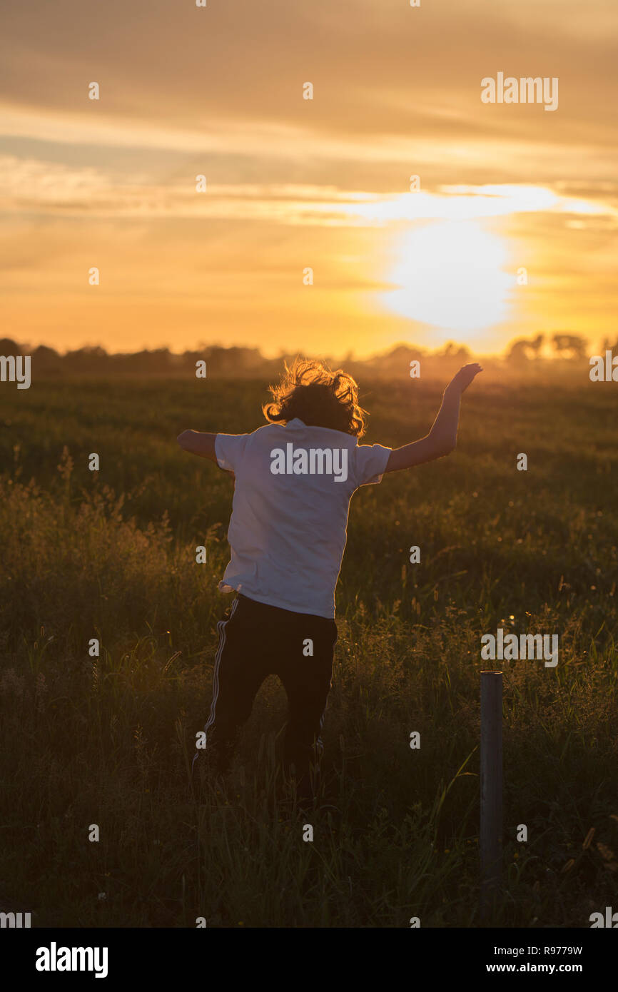 Boy teenager one field sunlight hi-res stock photography and images - Alamy
