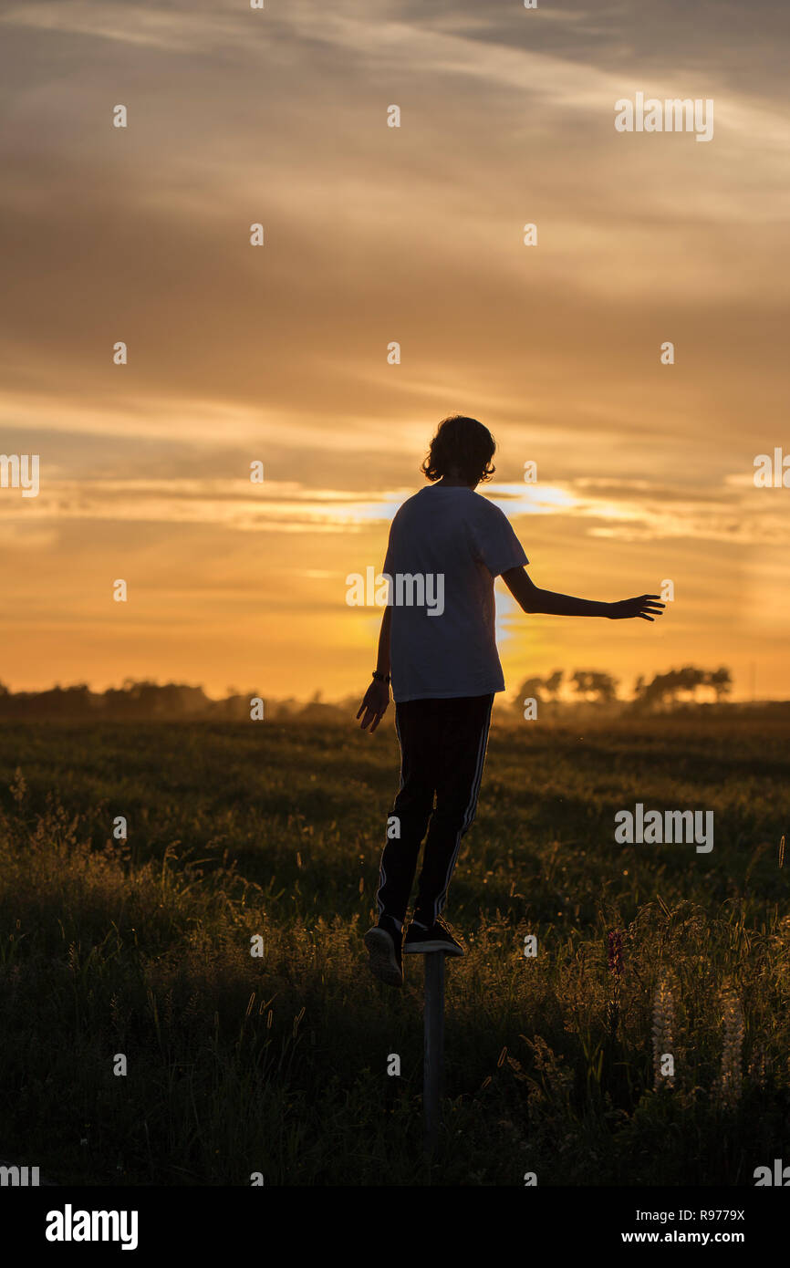Boy Balancing Fence High Resolution Stock Photography and Images - Alamy