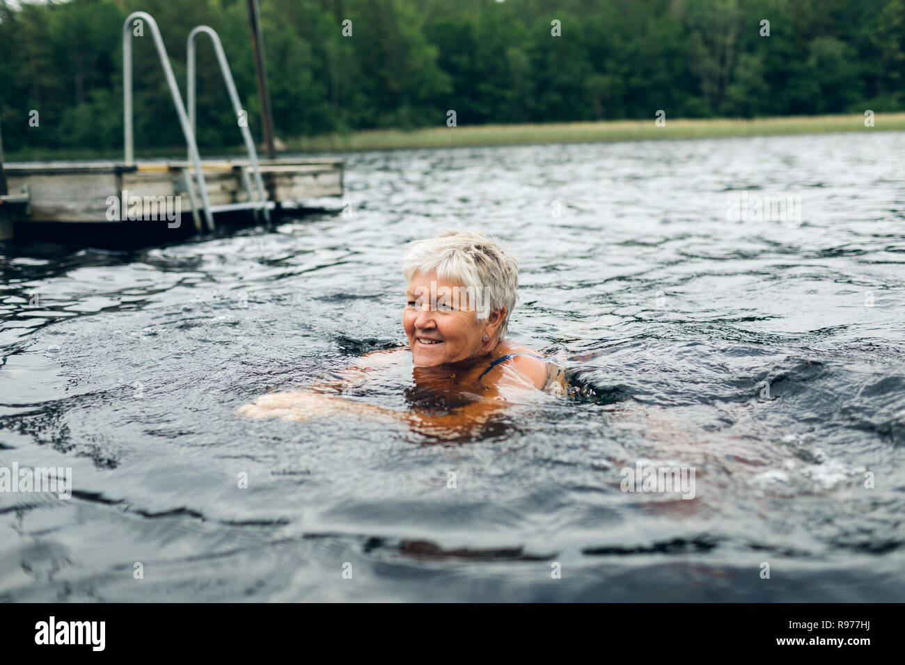 Senior woman swimming hi-res stock photography and images - Alamy
