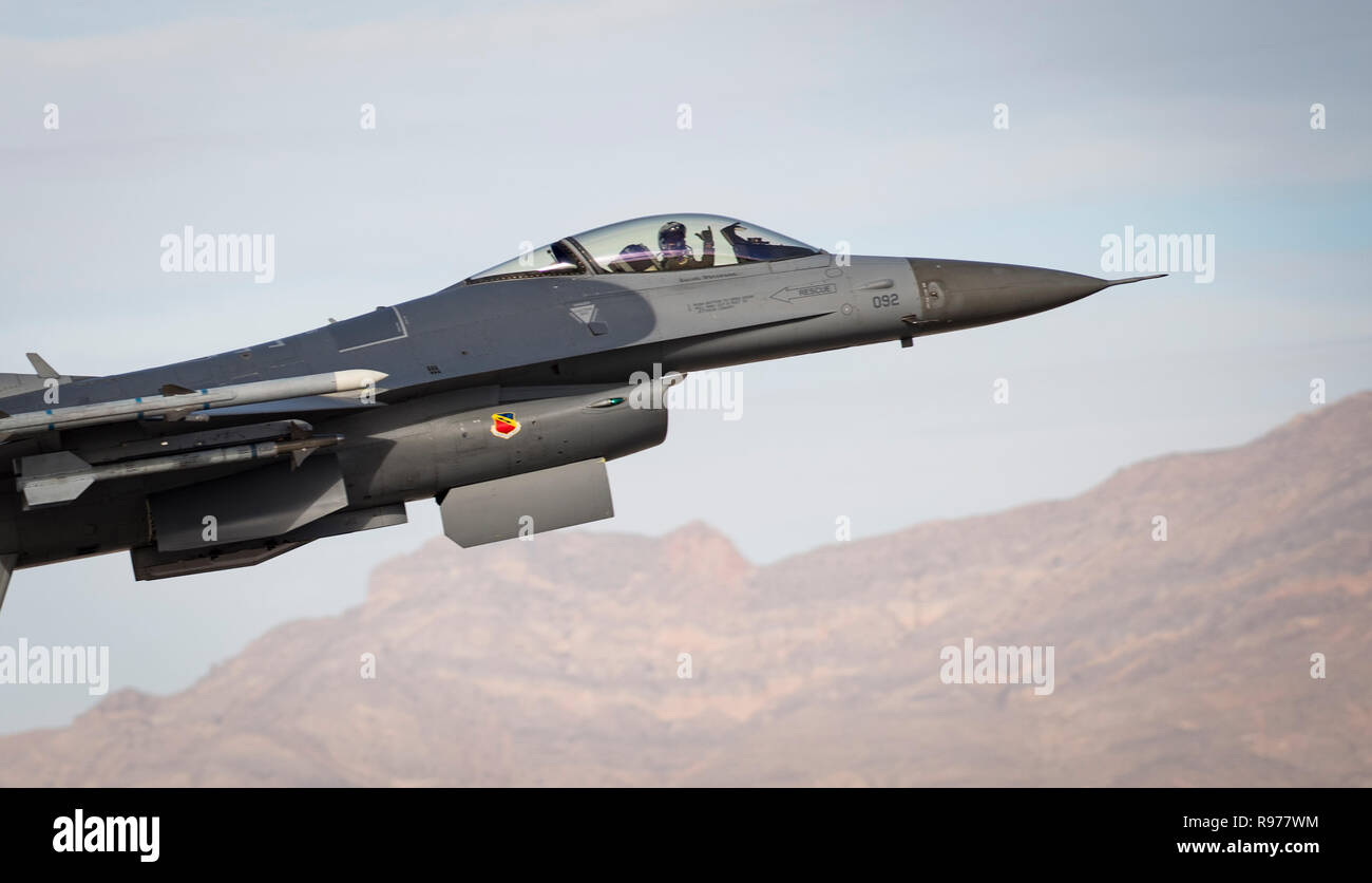 An F-16 Fighting Falcon fighting jet pilot signals after taking off ...