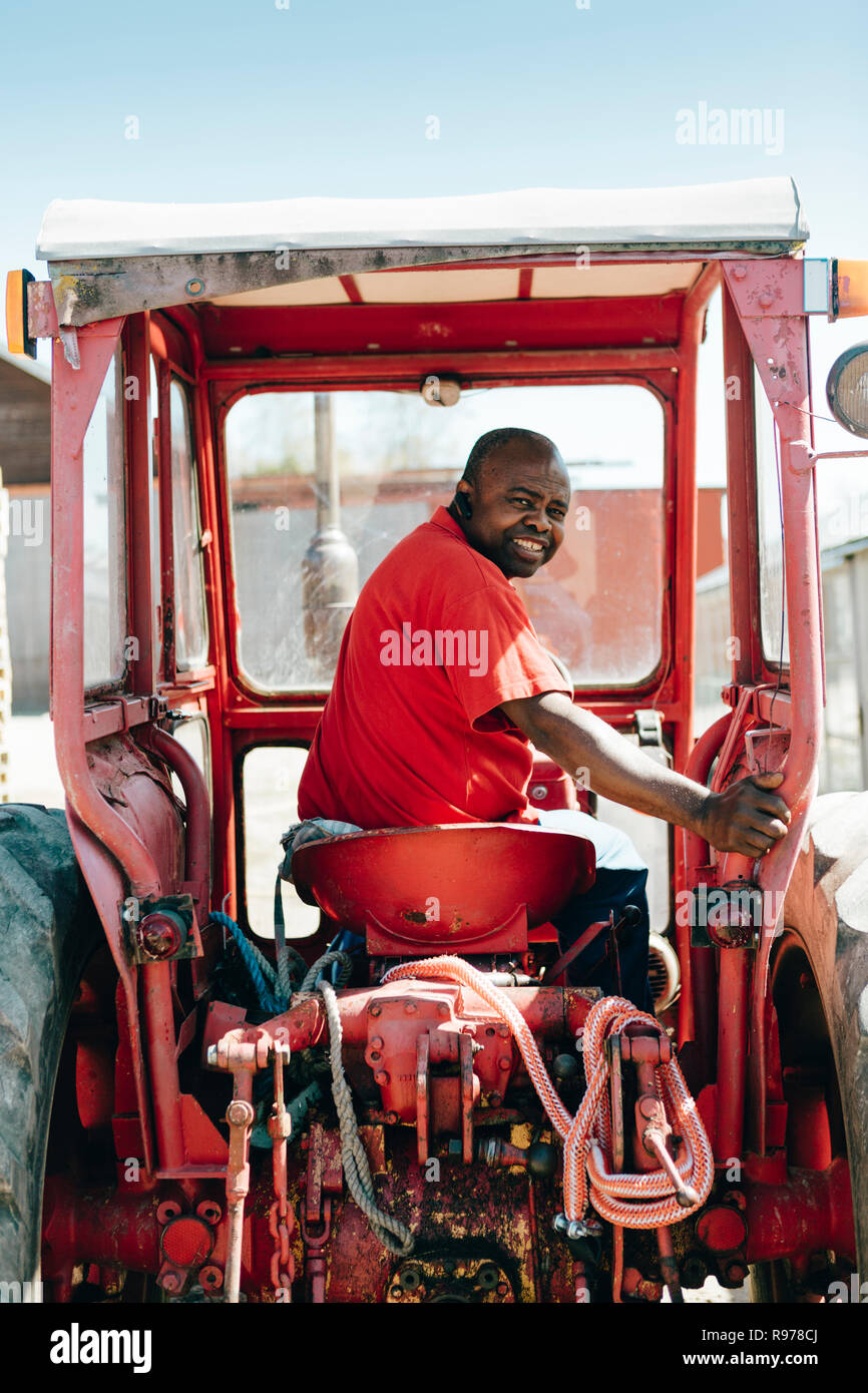 Worker with tractor hi-res stock photography and images - Alamy