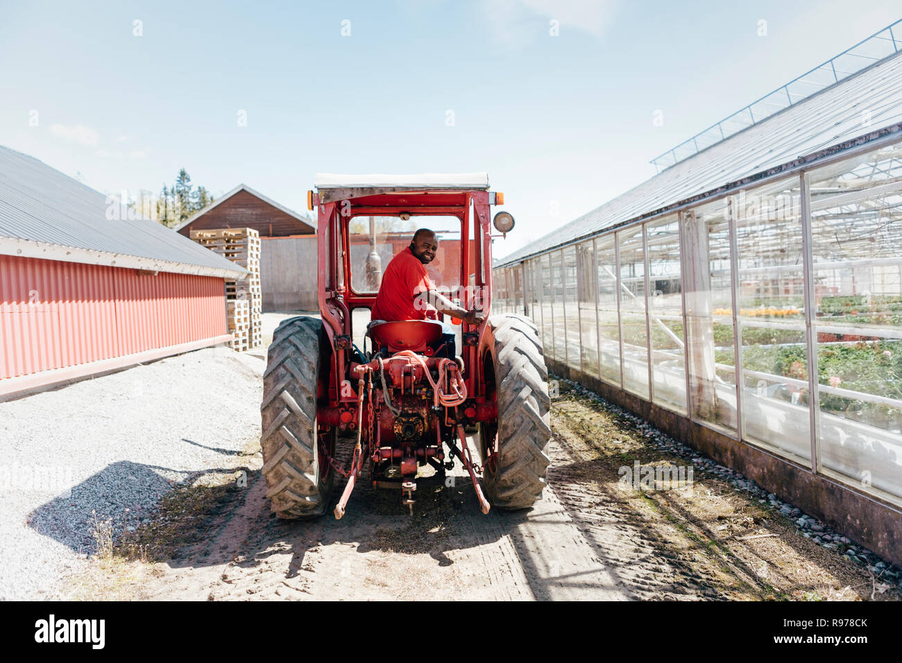 Worker with tractor hi-res stock photography and images - Alamy