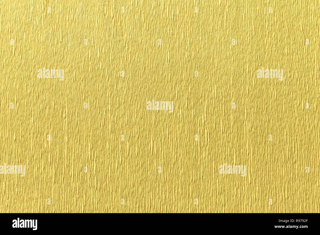 Textural of golden background of wavy corrugated paper, closeup ...
