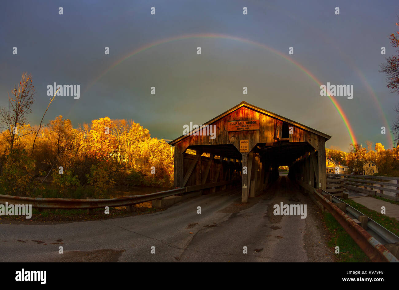 Rainbow over the Pulp Mill Bridge, a covered bridge that spans over ...