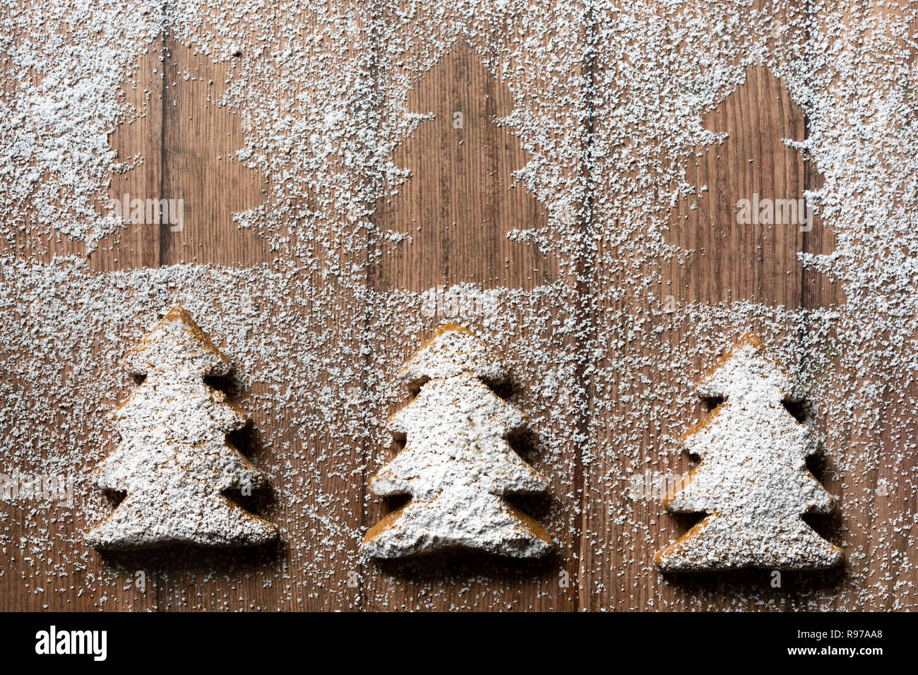 Three Christmas tree shaped gingerbread cookies Stock Photo - Alamy