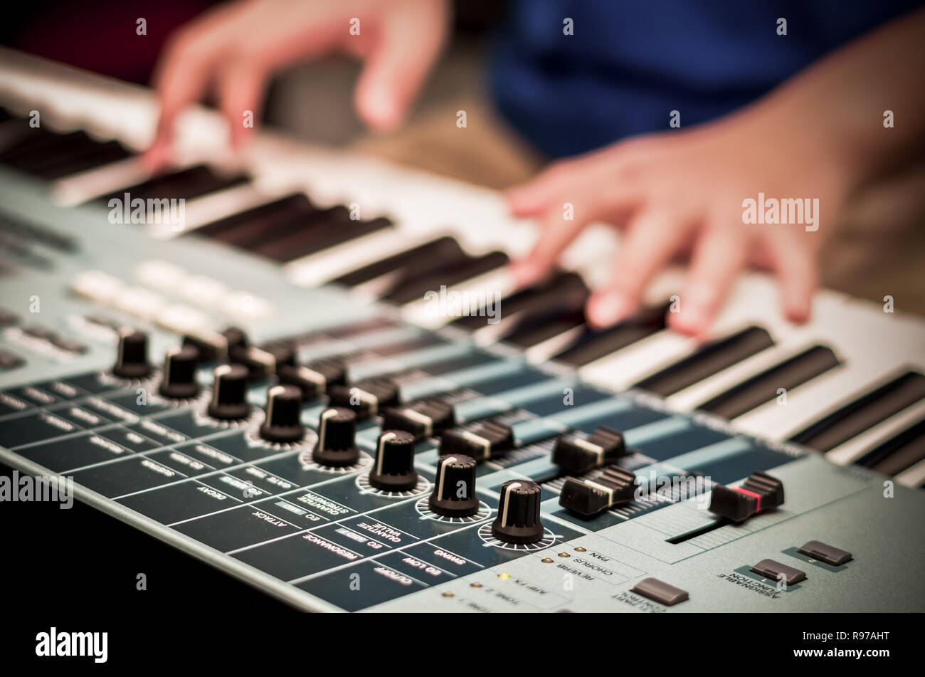 closeup audio mixer on hands playing the keyboard background,vintage ...